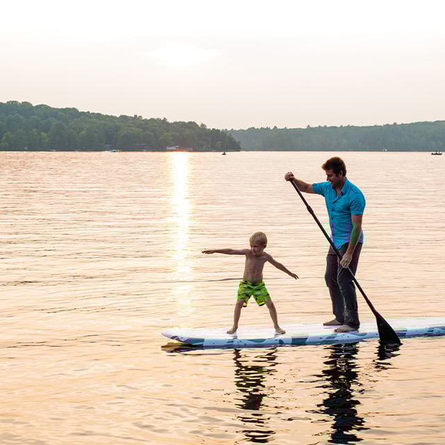 Dad and son paddleboarding