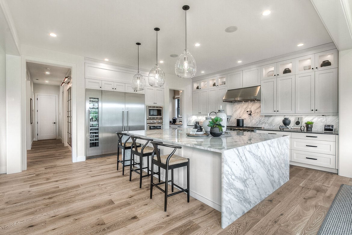 Wide angle of new construction home kitchen and entryway